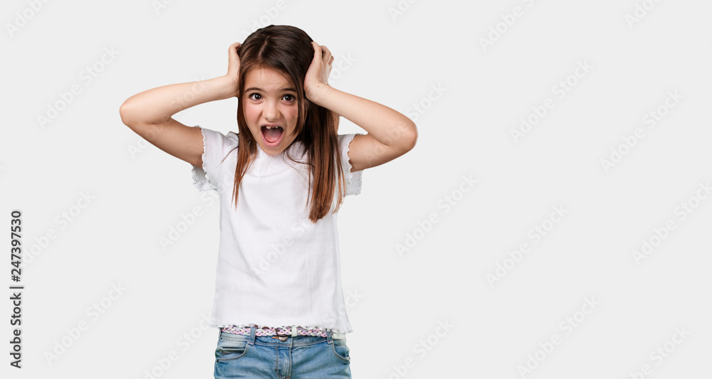 Full body little girl frustrated and desperate, angry and sad with ...