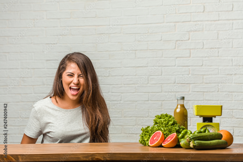 Concept of diet. Portrait of a healthy young latin woman screaming ...