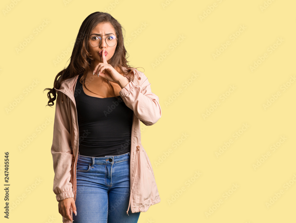 Full body young curvy woman keeping a secret or asking for silence ...