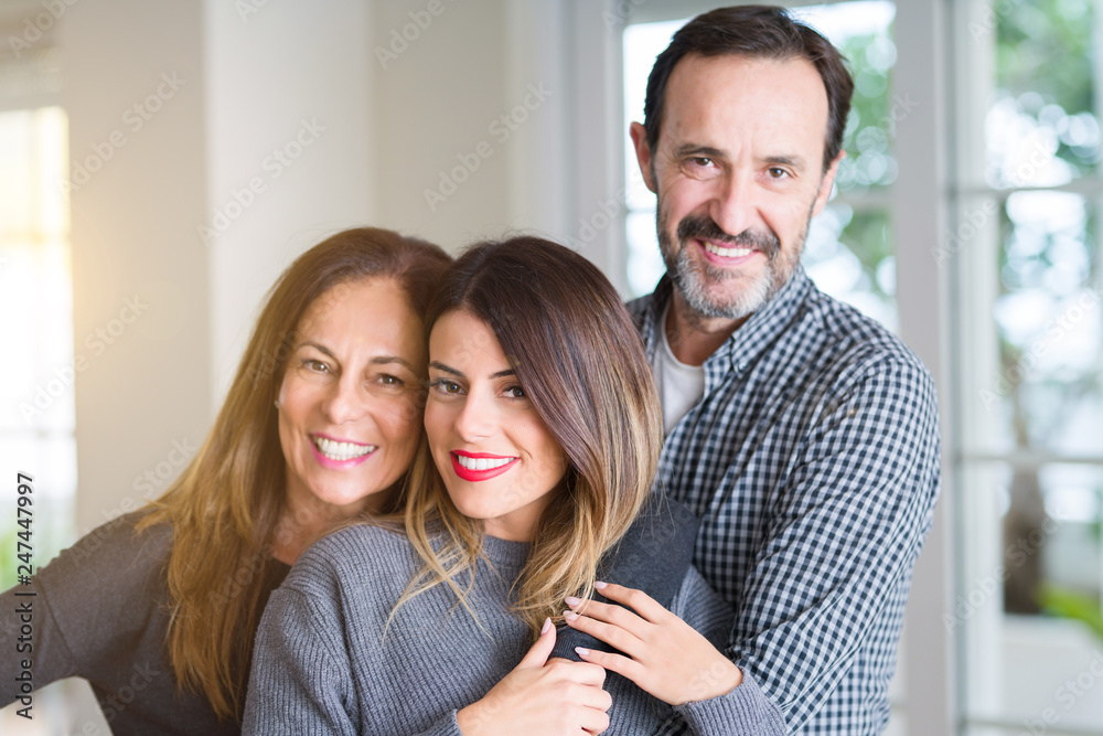 Beautiful family together. Mother, father and daughter smiling and ...