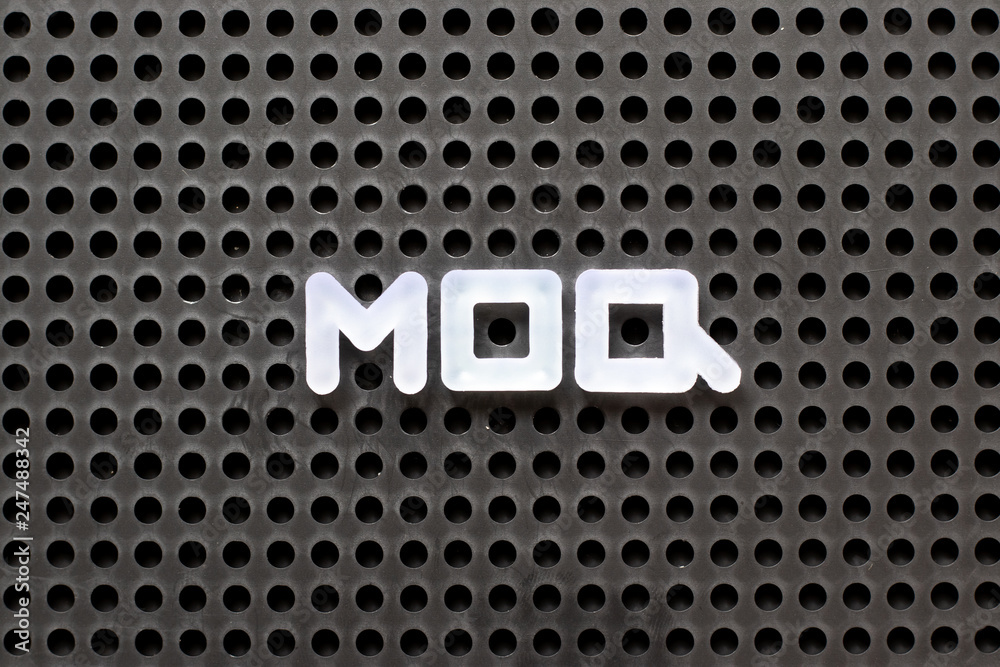 Black color pegboard with white letter in word MOQ (Abbreviation of ...