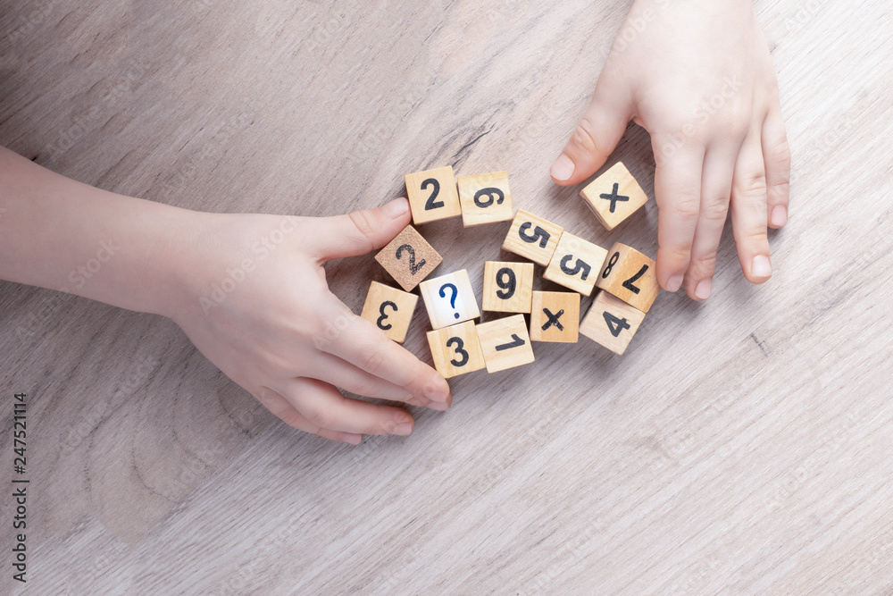 Wooden cubes with numbers. Teaching a child of preschool age ...