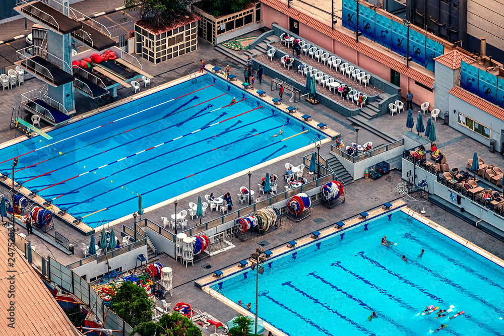 .18/11/2018 Cairo, Egypt, skyscraper view of sports pools where people ...