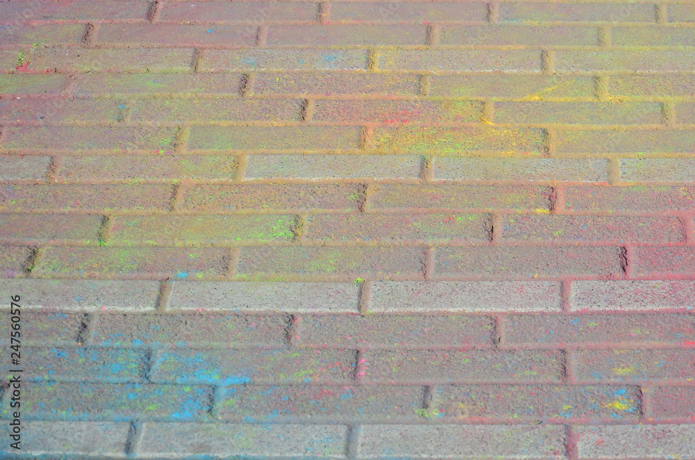 Multi colored paving slabs, powder coated with dry colors at the Holi ...