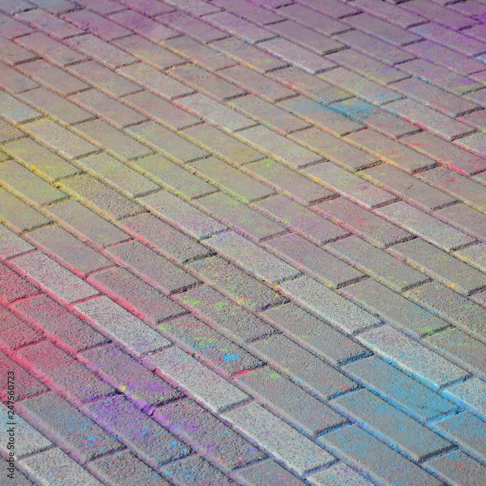 Multi colored paving slabs, powder coated with dry colors at the Holi ...