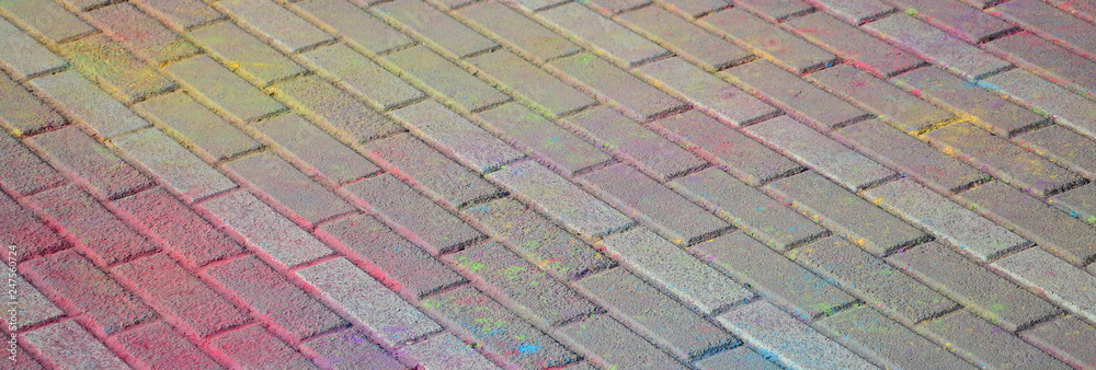Multi colored paving slabs, powder coated with dry colors at the Holi ...
