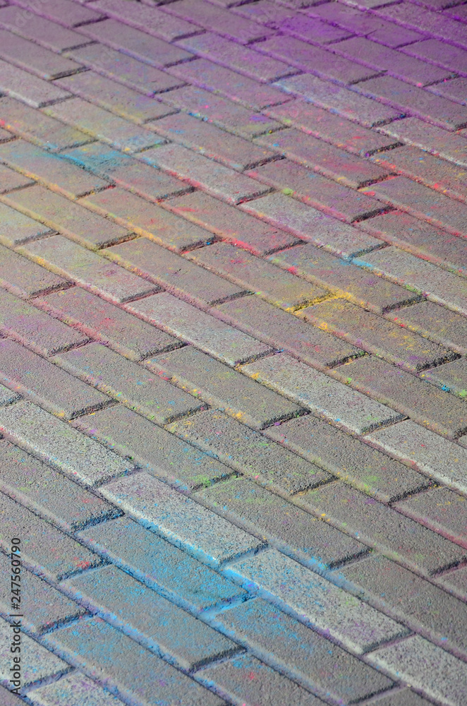 Multi colored paving slabs, powder coated with dry colors at the Holi ...