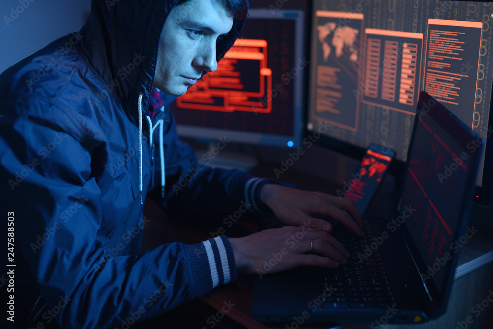 Hacker Typing Program Code While Committing A Cybercrime Hacking A