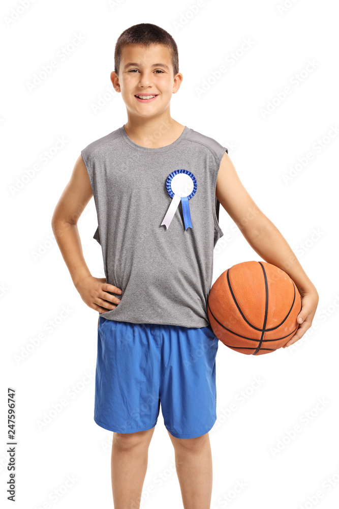 Young boy with a winner badge and basketball Stock Photo | Adobe Stock
