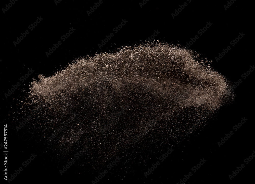 Dry soil splash or explosion flying in the air on black background,Stop ...