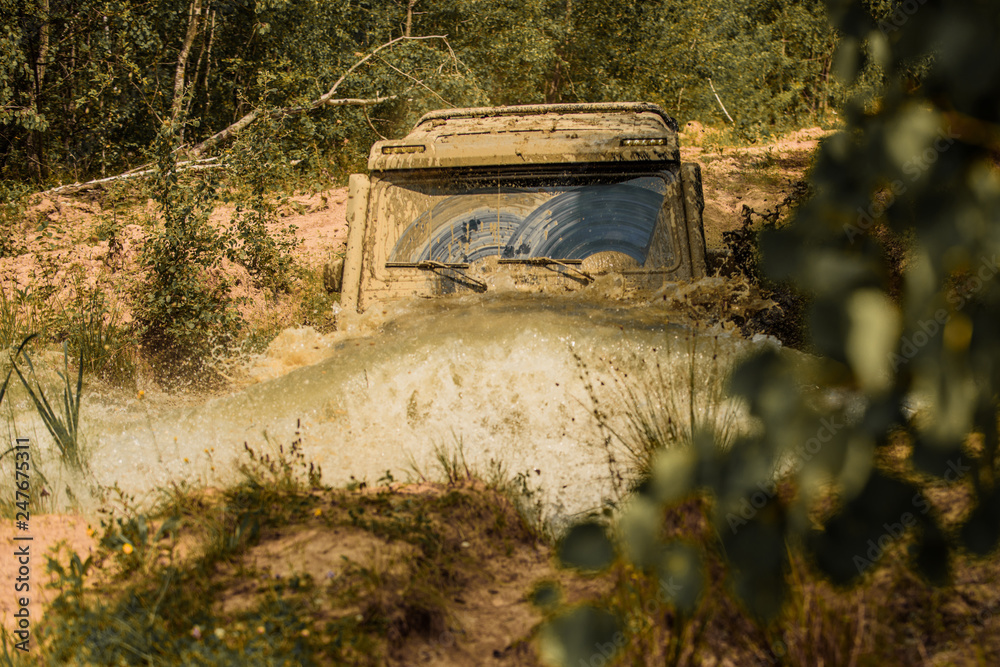 Mud and water splash in off the road racing. Mud and water splash in ...