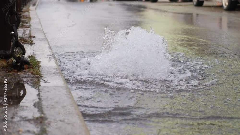 Footage of water comming out from a road drainage due to a ruptured ...