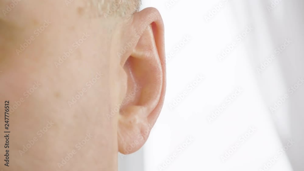 Adult male ear close up. Man moving his ear macro shooting ...