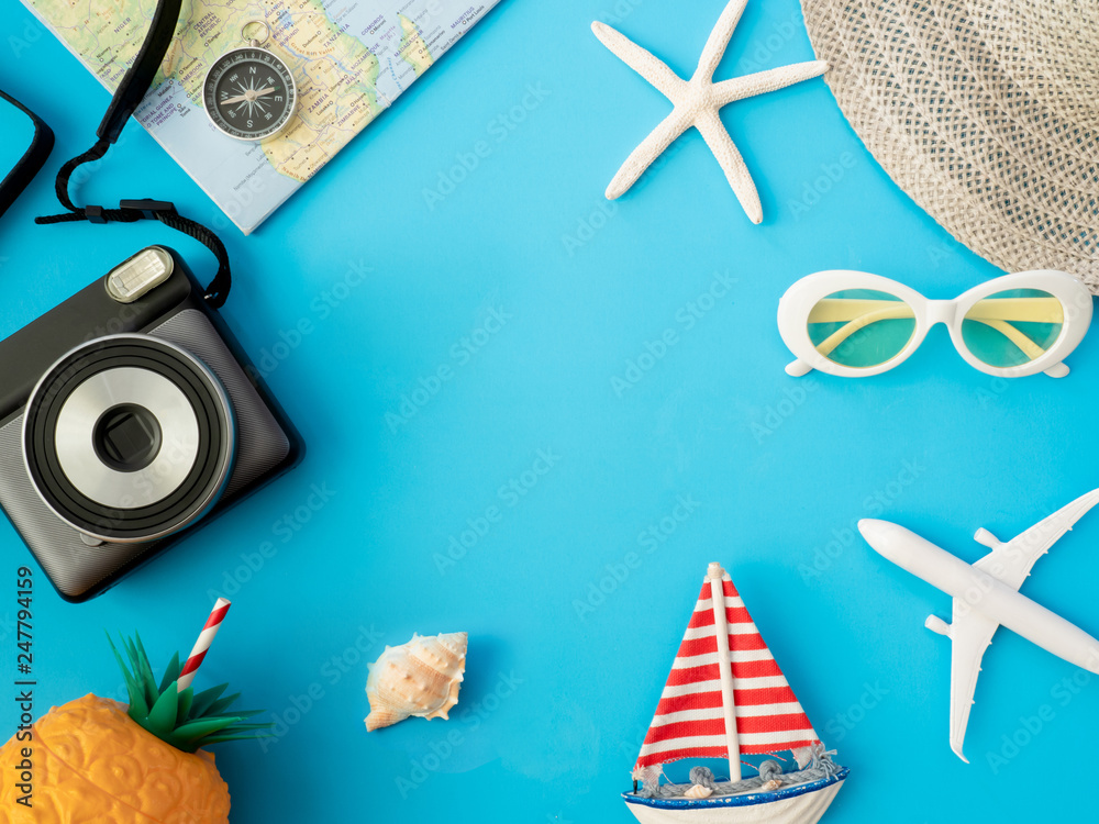 top view travel concept with instant camera films, map, passport and ...