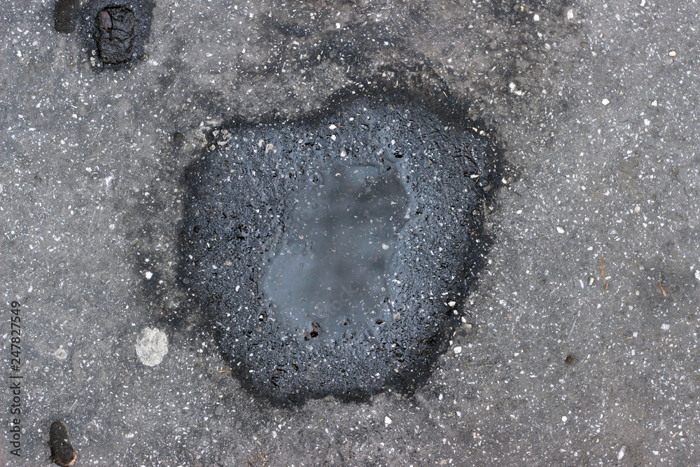 Wet asphalt puddle water pavement sidewalk surface texture Stock Photo ...