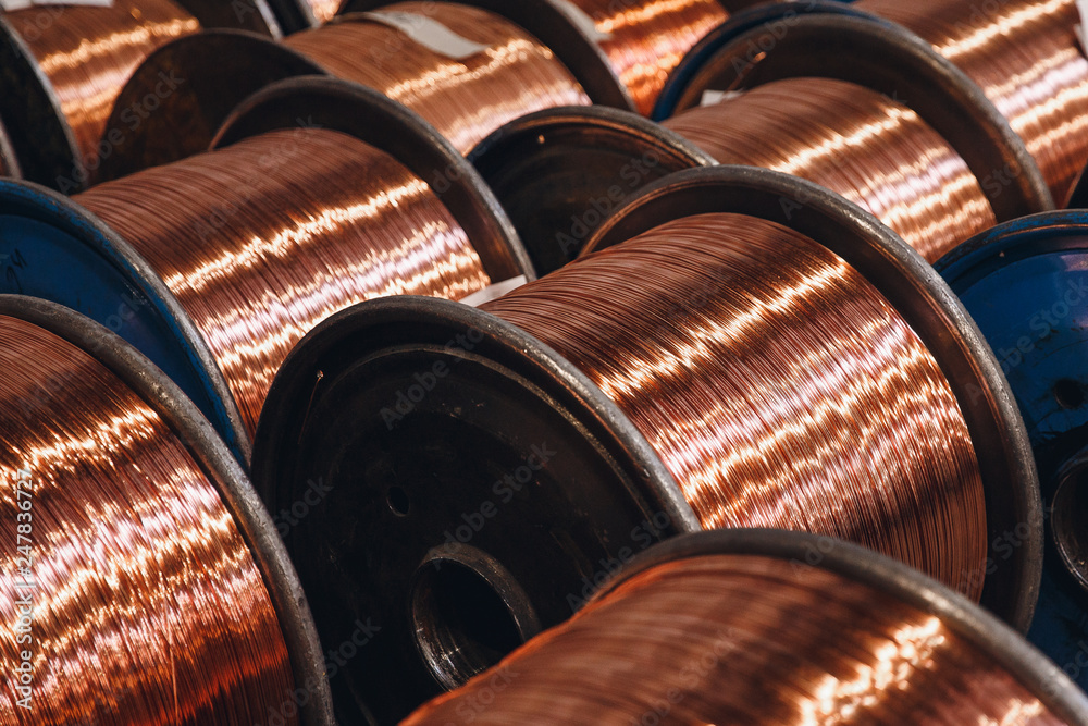 Production of copper wire, bronze cable in reels at factory Stock Photo ...