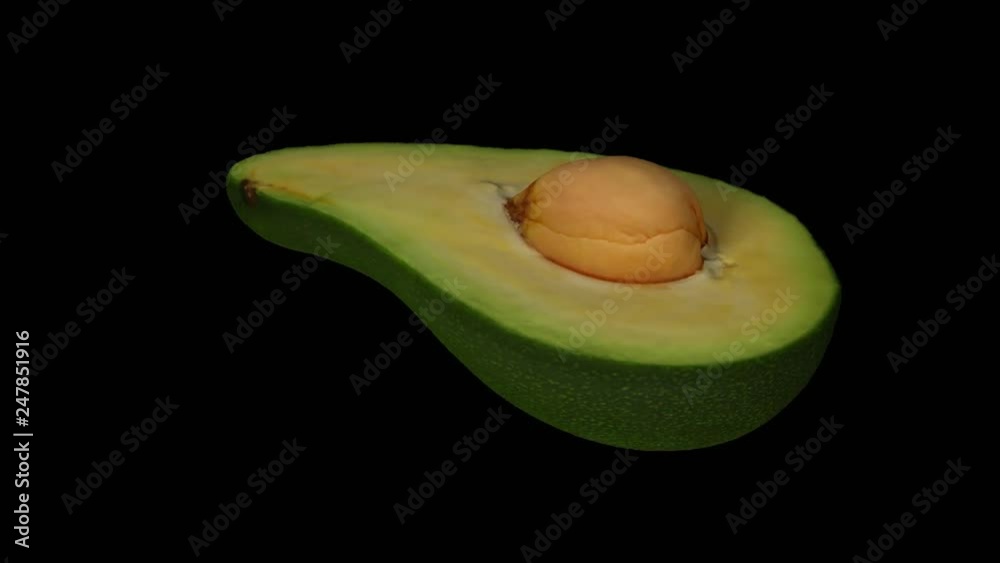Realistic render of a rotating green Florida avocado (cut in half with ...
