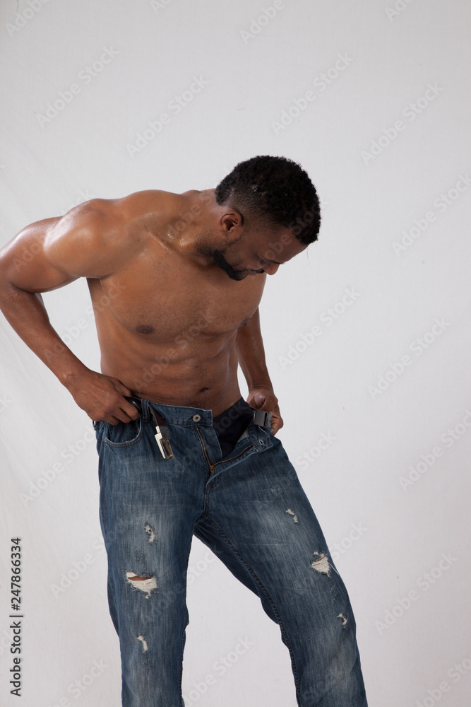 Handsome, shirtless black man looking down Stock Photo | Adobe Stock
