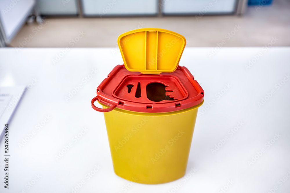 Yellow biohazard medical contaminated sharps clinical waste container ...