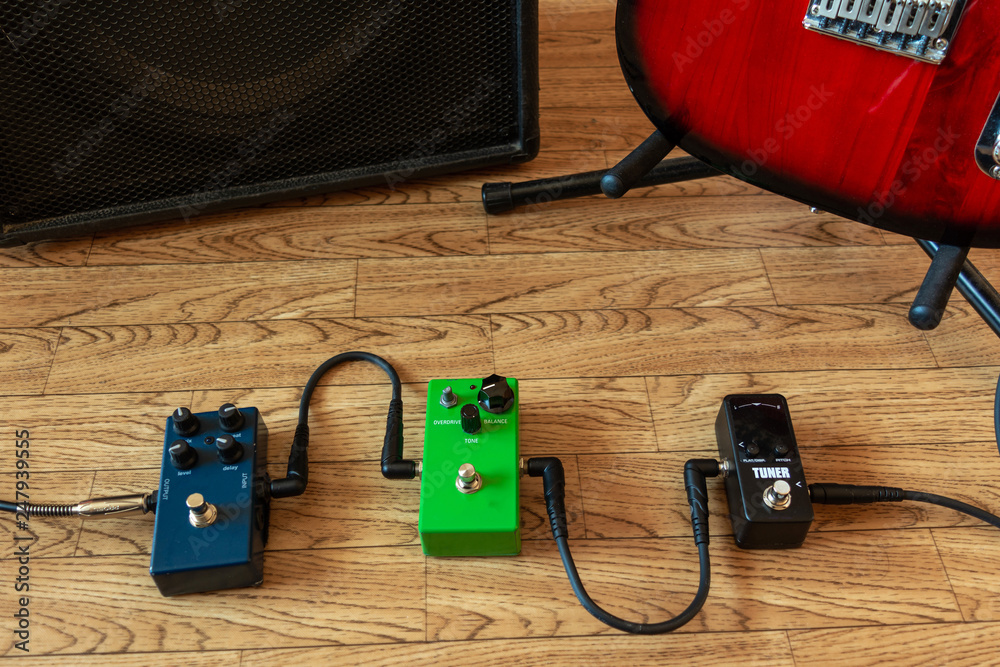 Setting up guitar audio processing effects. Electric guitar stomp box ...