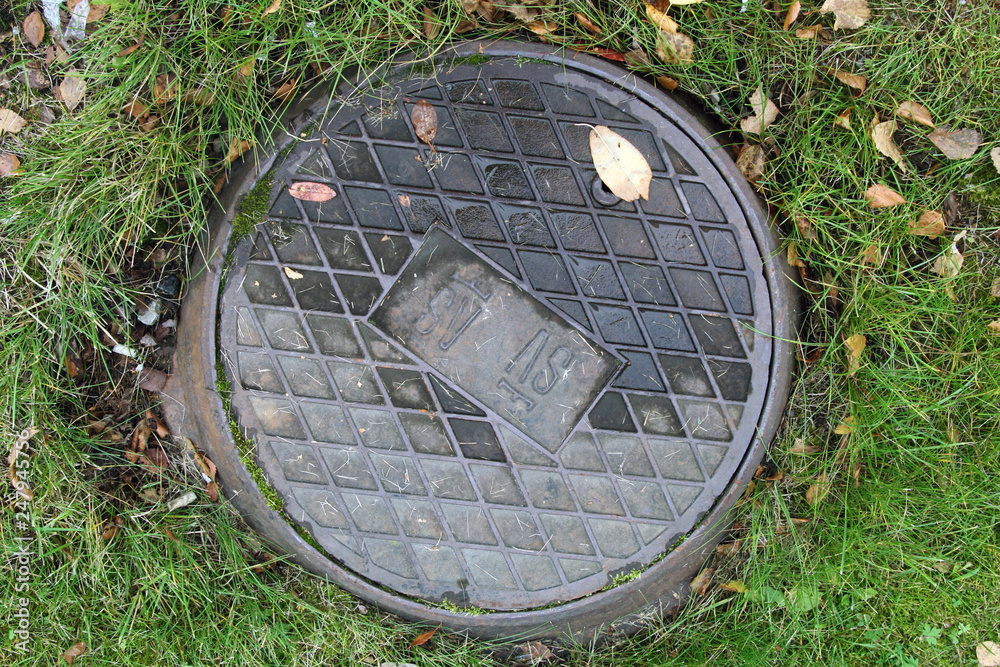 Scandinavian manhole in its urban surrounding. Hidden beauty in design ...