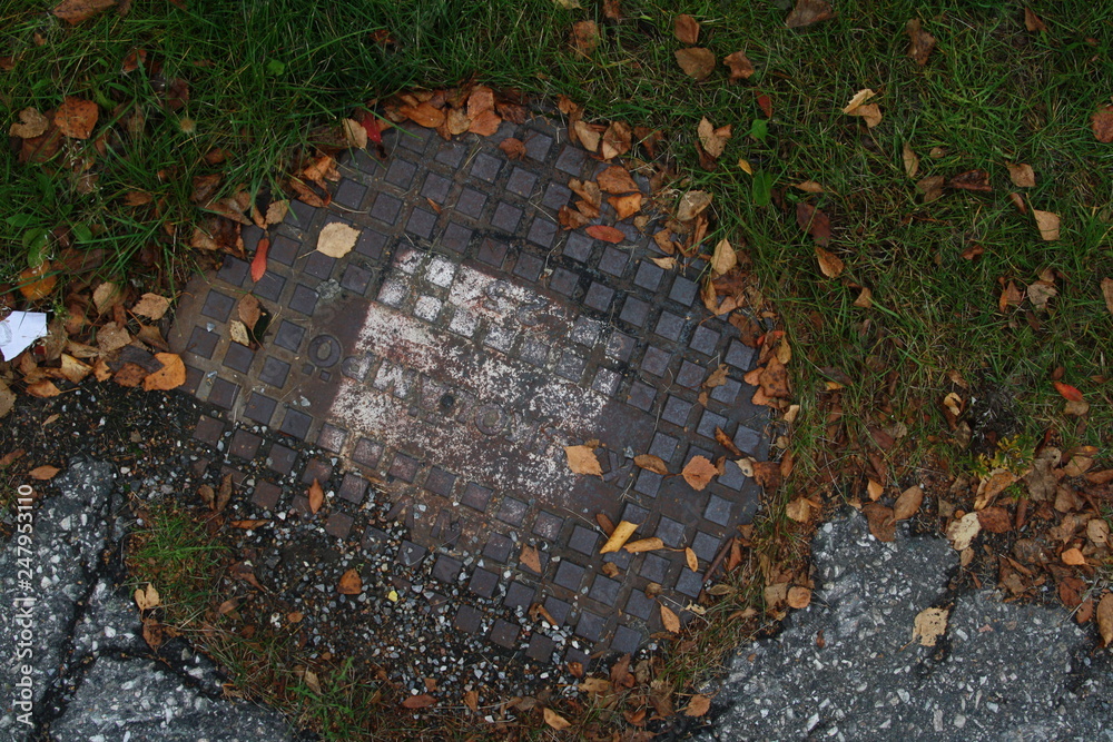 Scandinavian manhole in its urban surrounding. Hidden beauty in design ...