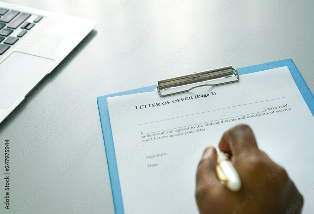Letter of offer to be signed by potential hire Stock Photo | Adobe Stock