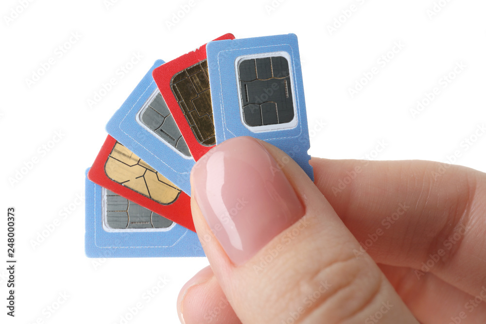 Female hand holding sim cards on white background Stock Photo | Adobe Stock
