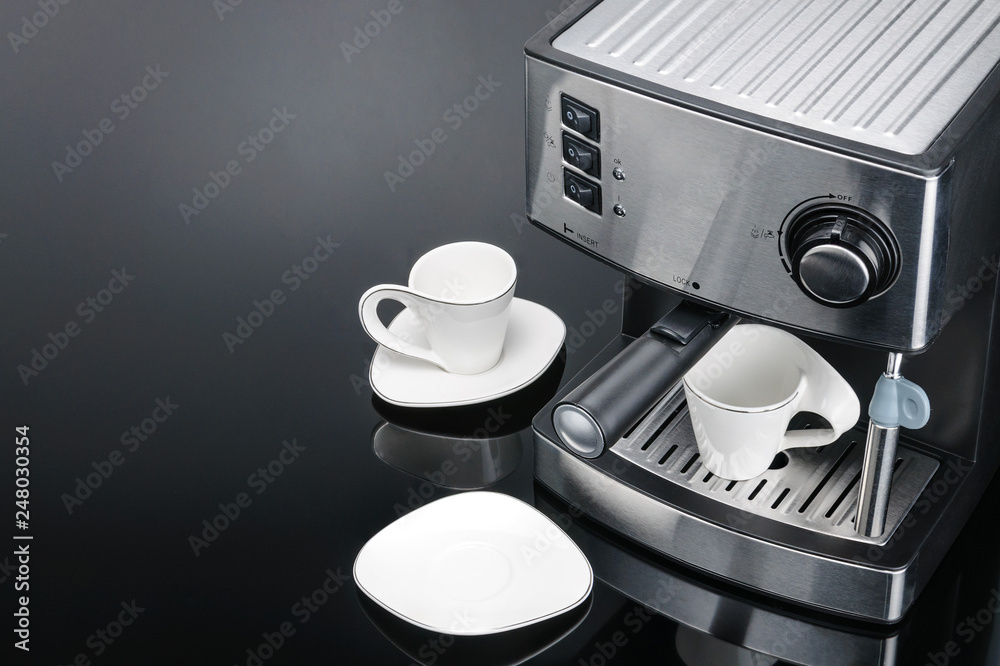 Espresso coffee machine on the grey mirror background with copy space ...