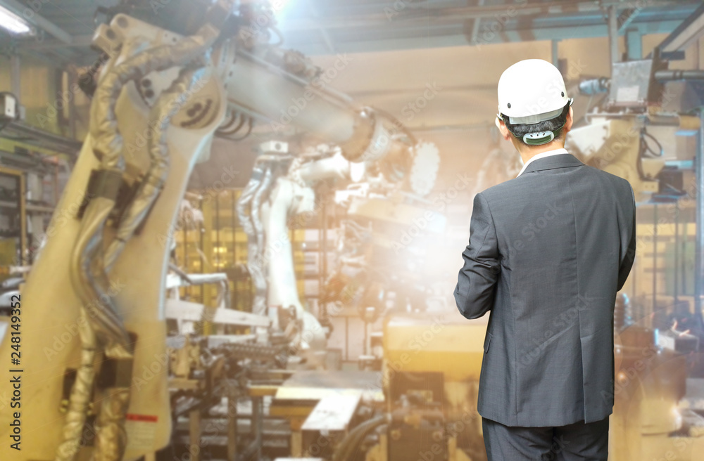 Man hand holding tablet with automate wireless Robot arm in smart ...