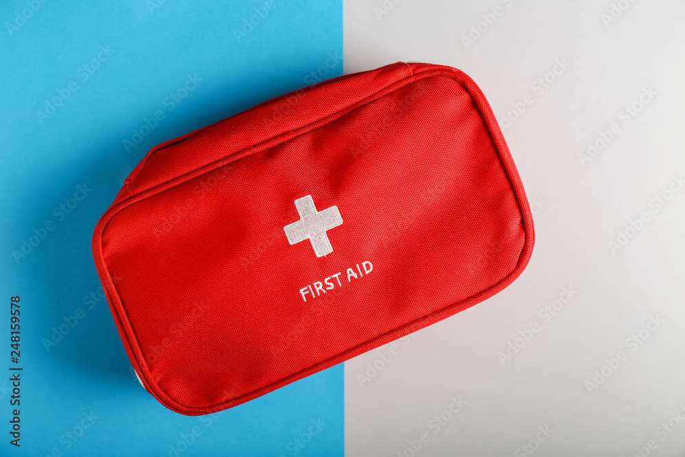 First aid kit on color background Stock Photo | Adobe Stock