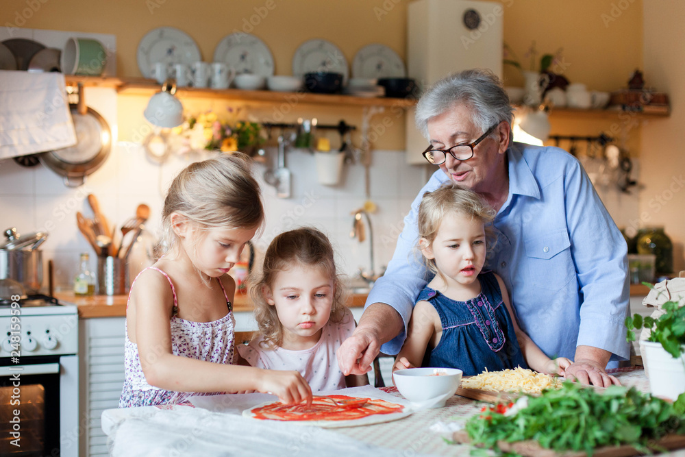 Pizza cooking class for kids, children chef. Cute girls are preparing ...