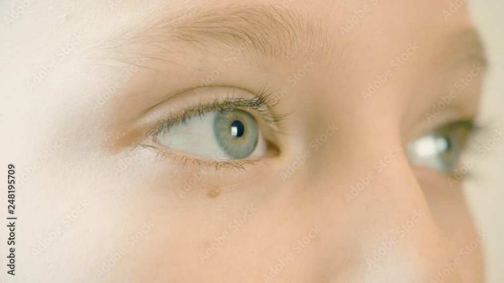 Close up face of teenager girl looking and winking. Face and eyes young ...