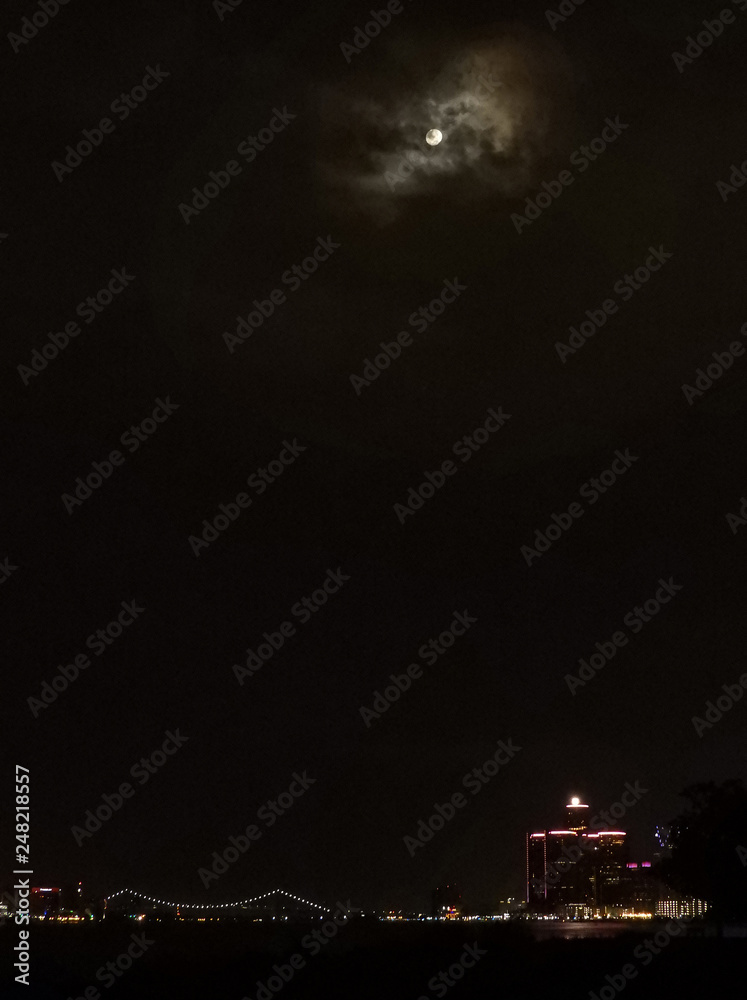 Detroit skyline and Ambassador Bridge at night shot from Belle Isle ...