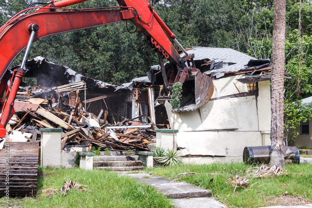 Knocking down a house that is beyond repair Stock Photo | Adobe Stock