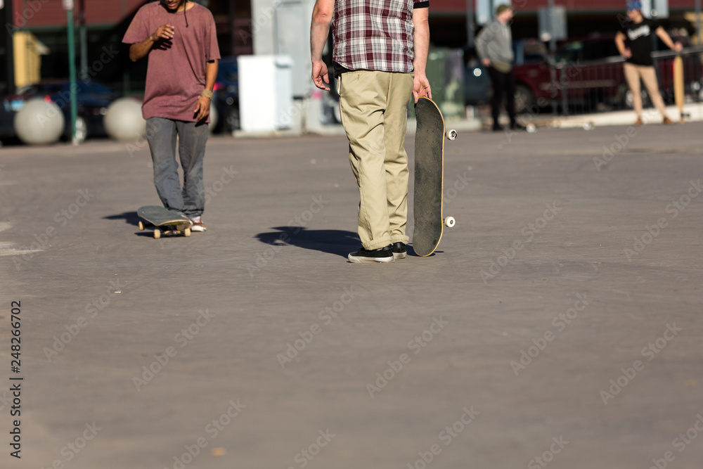 Person riding a skate board in an urban asphalt park Stock Photo ...