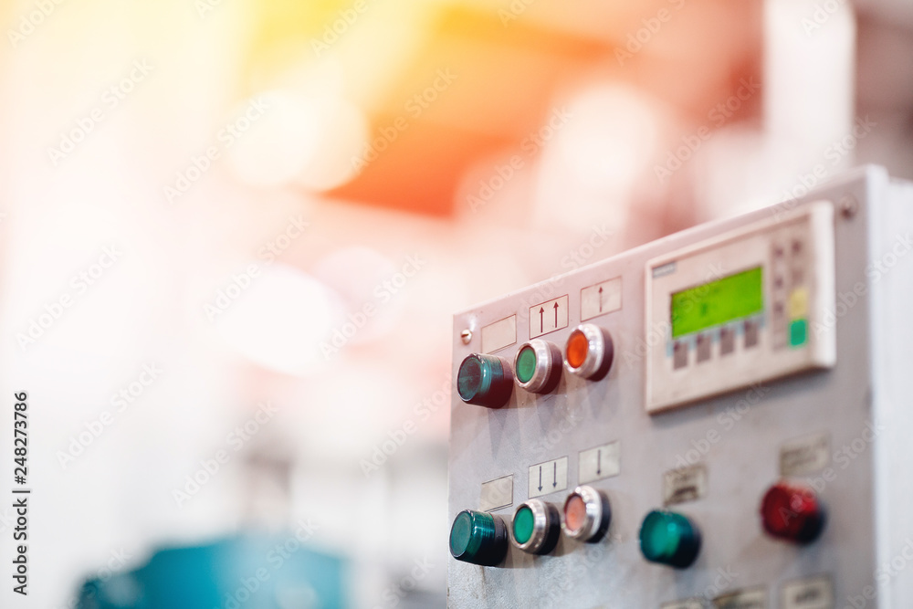 Control buttons in industrial production, blurred background. Heavy ...
