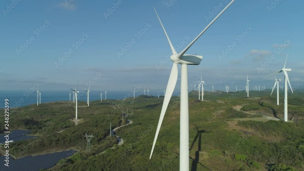 Aerial view of Windmills for electric power production on the seashore ...