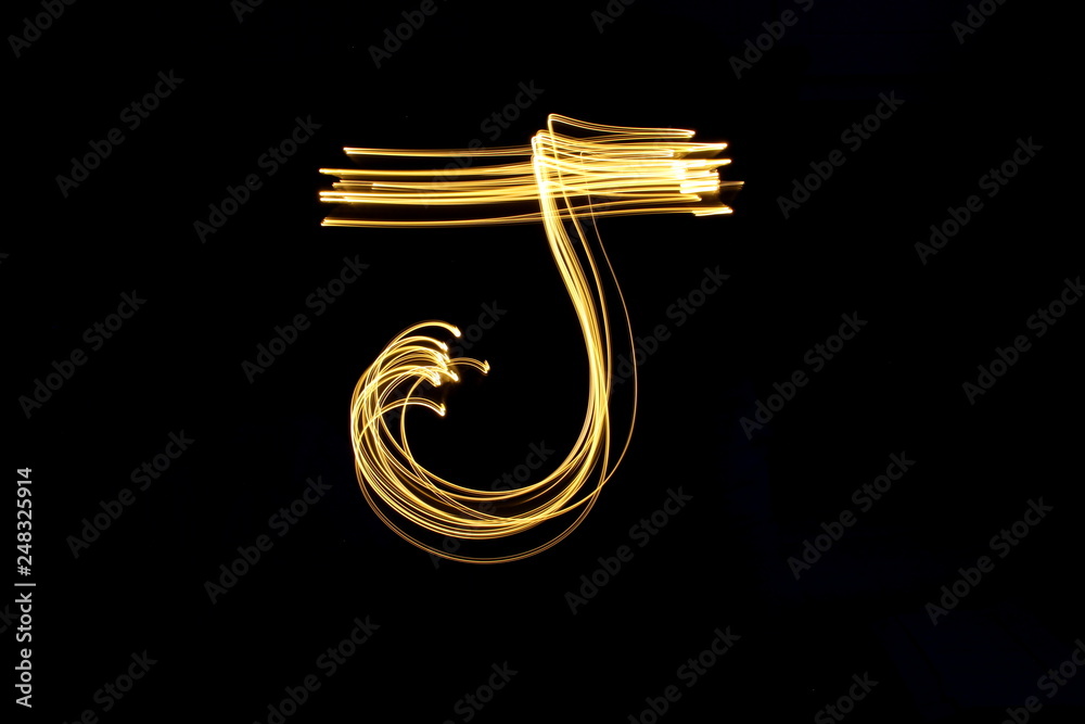 Long exposure, light painting photography. Letter j in a vibrant neon ...