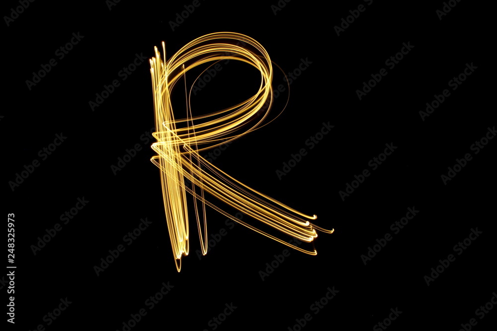 Long exposure, light painting photography. Letter r in a vibrant neon ...