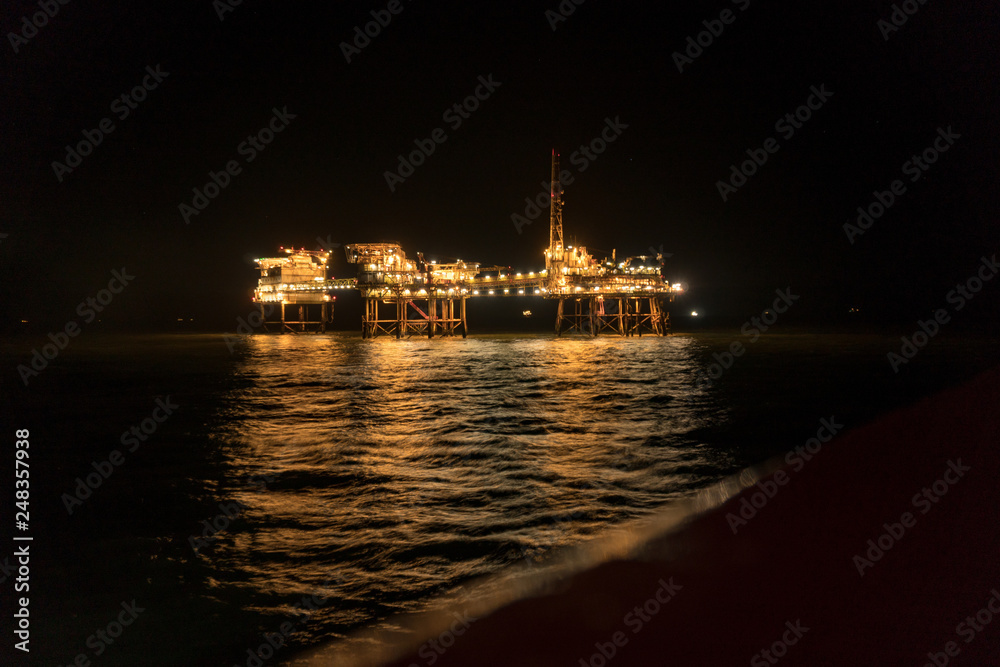 Offshore oil platform complex at night Stock Photo | Adobe Stock