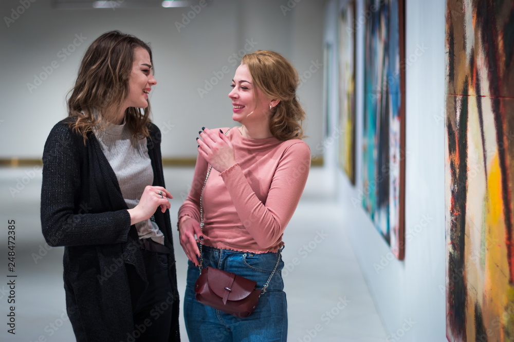 two girls discuss paintings in Gallery of modern art Stock Photo ...