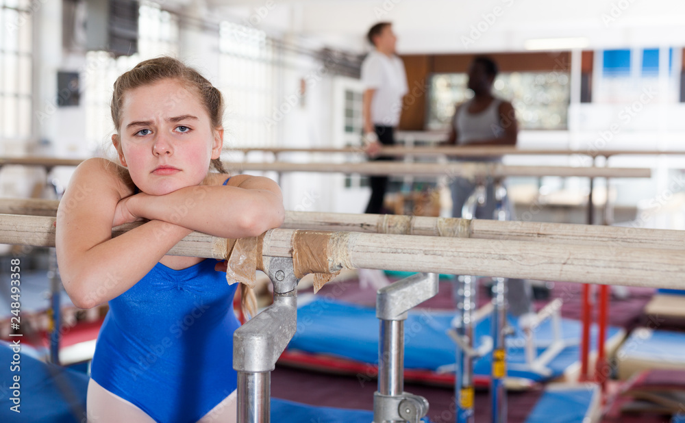 Sad teenage girl in gym Stock Photo | Adobe Stock