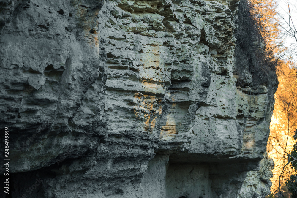 Picturesque background of collapsing surface of limestone rock ...