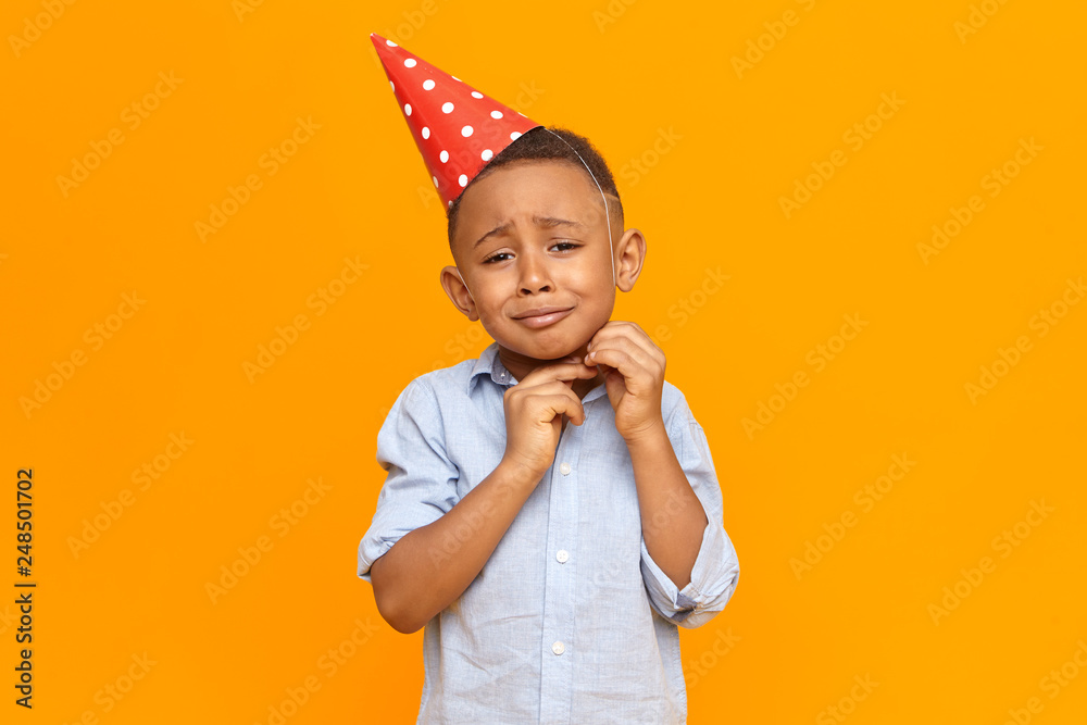 Disappointed upset black ten year old birthday boy crying because of ...