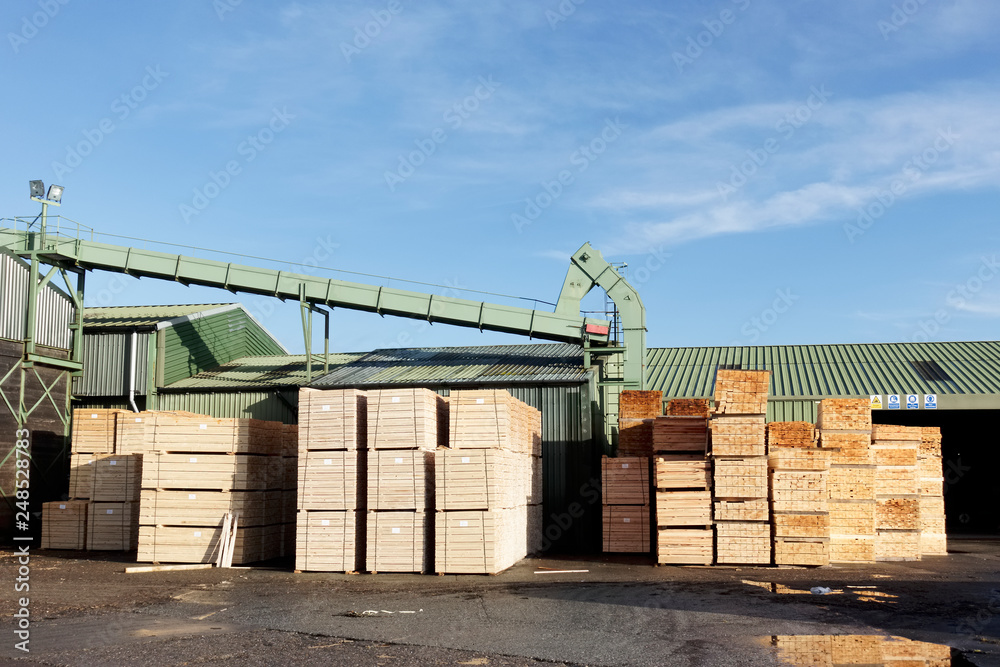 Wood chips pellets chopped wooden logsand stacked wooden pallets for ...