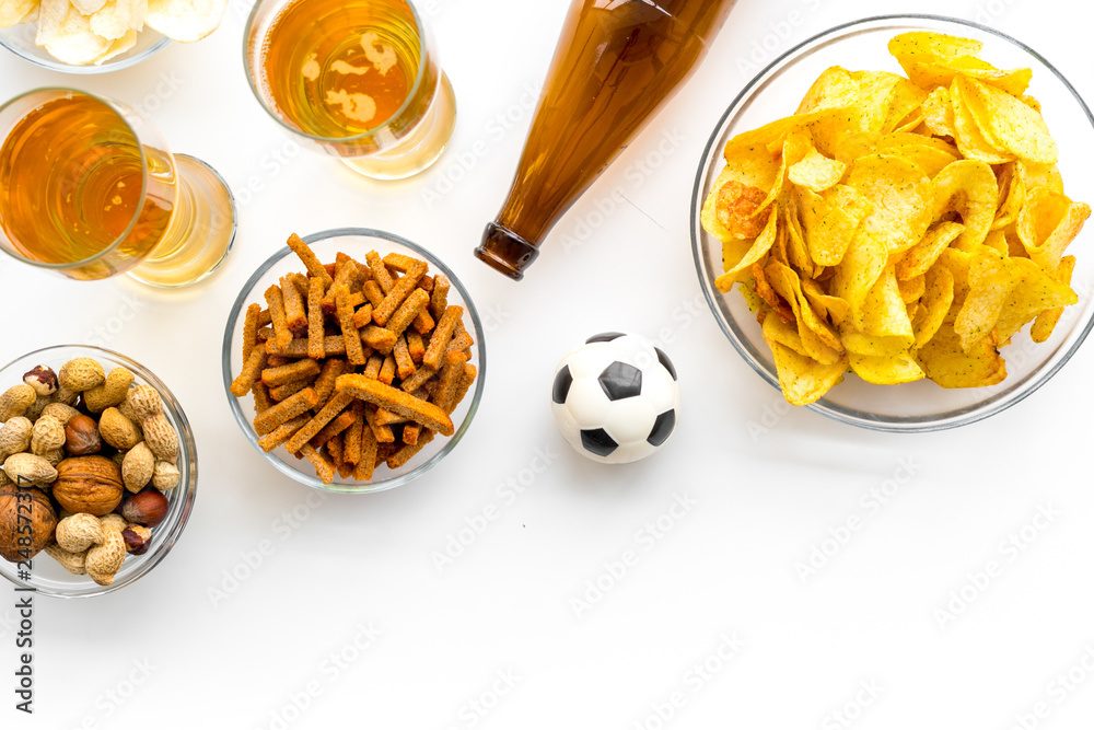 Snacks for watching football on TV. Watching sports. Chips, nuts, rusks ...