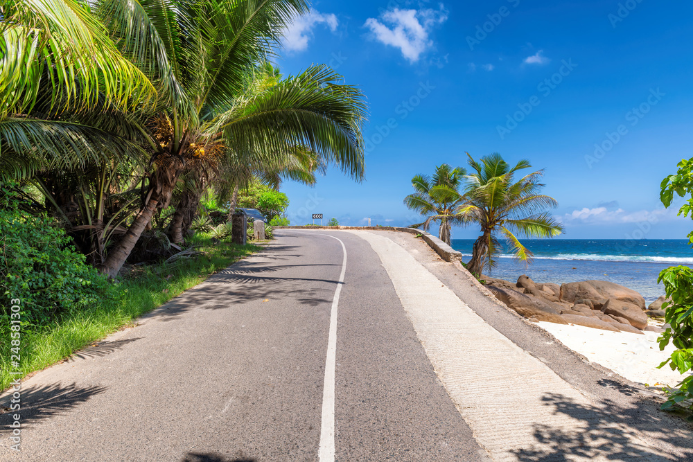 Road trip. Beach palms road in paradise island, Mahe, Seychelles Stock ...