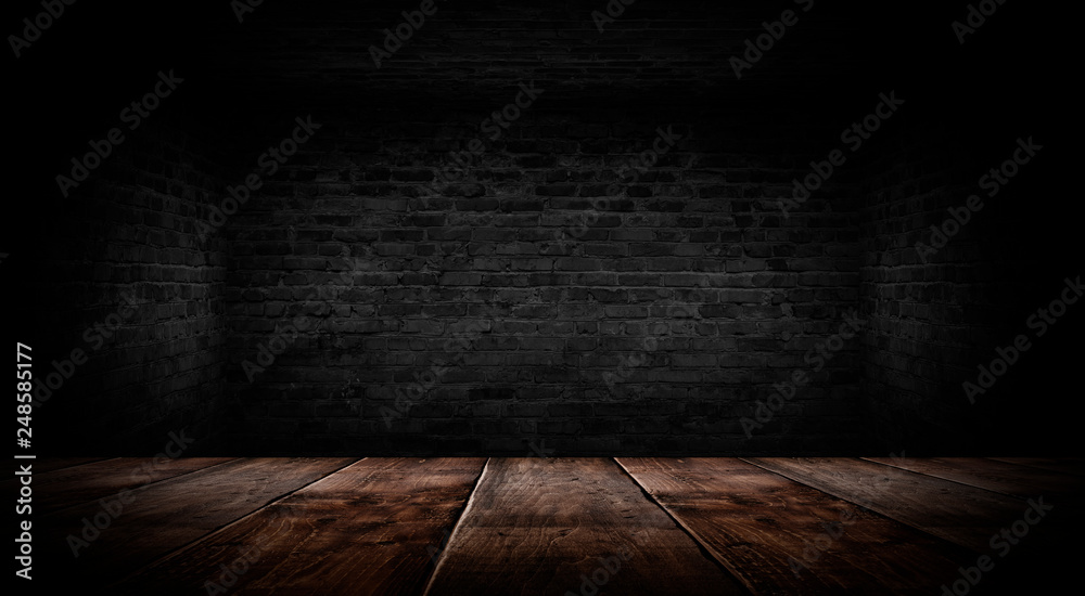 background of an empty black room, a cellar, lit by a searchlight ...