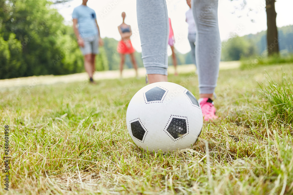 Friends playing soccer in the park Stock Photo | Adobe Stock